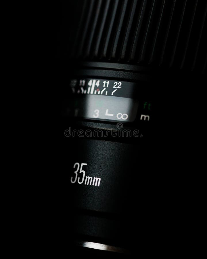Vertical Shot of a 35mm Camera Lens Isolated on a Dark Backgroun Stock ...