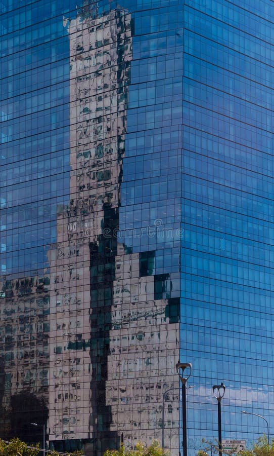 Vertical Shot of a Modern Building with Reflections of the Old ...