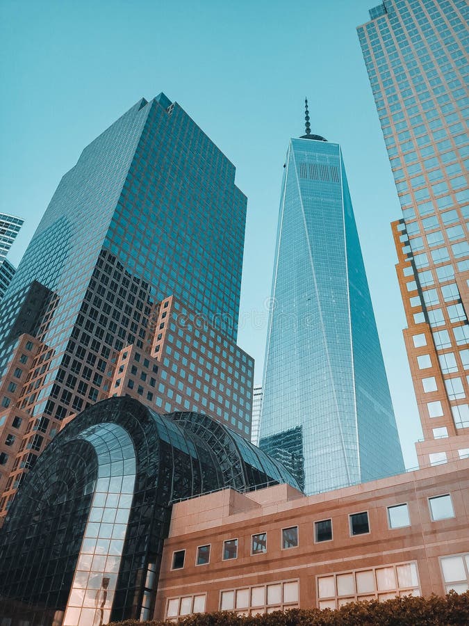 Vertical Shot of a Futuristic City with Tall Glass Buildings and Lots ...