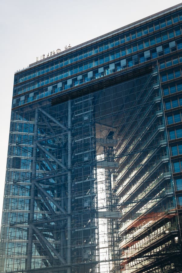 Vertical Shot of a Modern Glassy Building with Its Holding Structures ...