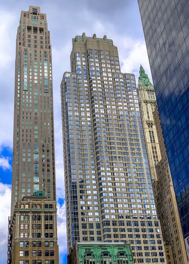 Vertical Shot of Modern High-rise Buildings Under a Rainy Cloudscape in ...