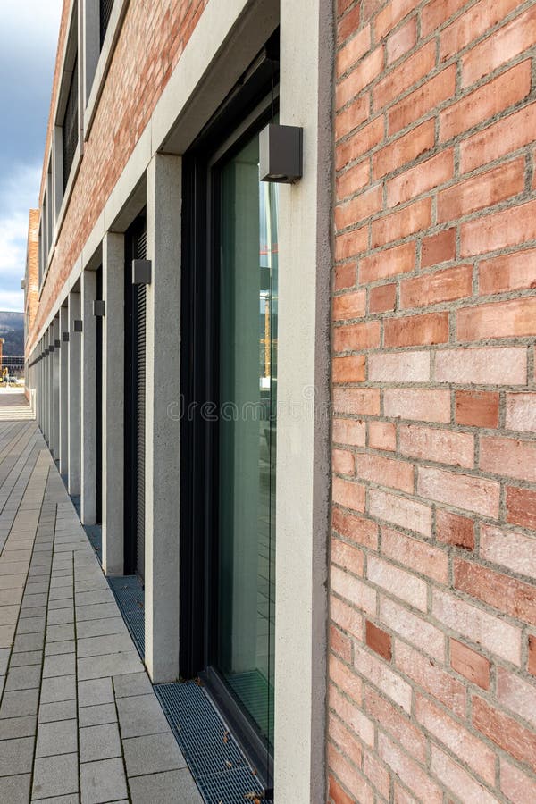 Vertical Shot of a Modern House Front with Red Bricks and Large Windows ...
