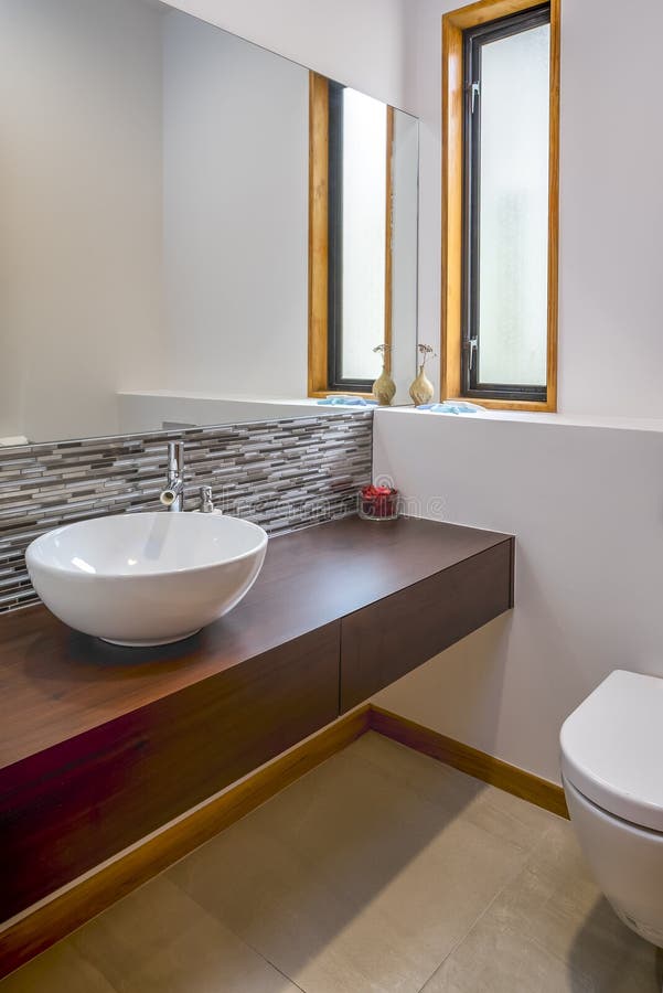 Vertical Shot of the Modern Sink in the Bathroom of an Apartment Stock ...