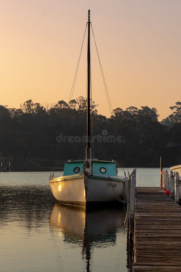 Vertical Shot of a Moored Boat on the Dock of Mallacoota, Australia at ...