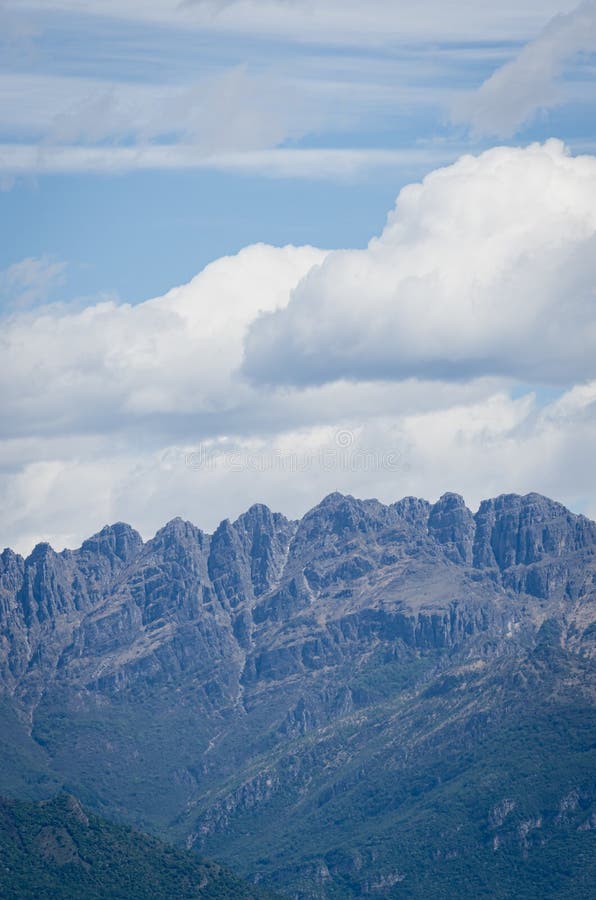 Vertical Shot of the Mountain Range of the Venetian Prealps Under Think ...