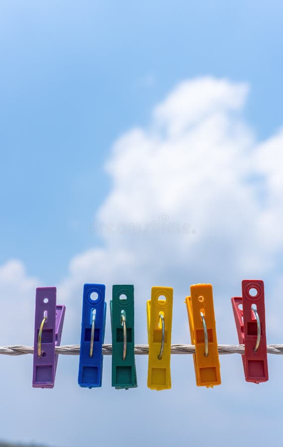Vertical Shot of Multicolored Plastic Clothespins on an Empty Rope ...