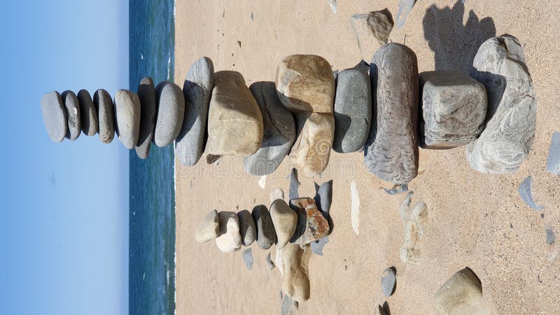 Vertical Shot of Multiple Small Rocks Stacked on Each Other Stock Photo ...