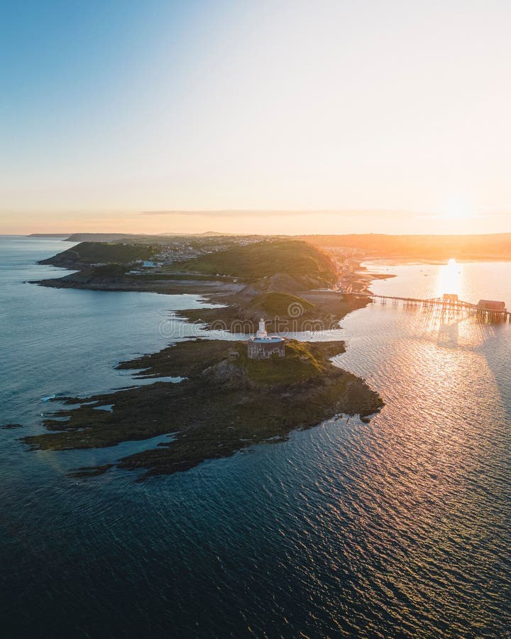 Vertical Shot of the Mumbles Lighthouse at Sunset Stock Photo - Image ...