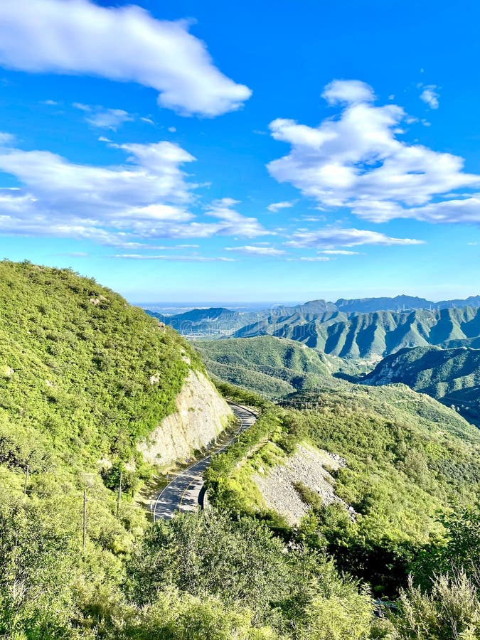 Vertical Shot of the Narrow Highway between the Green Hills and ...