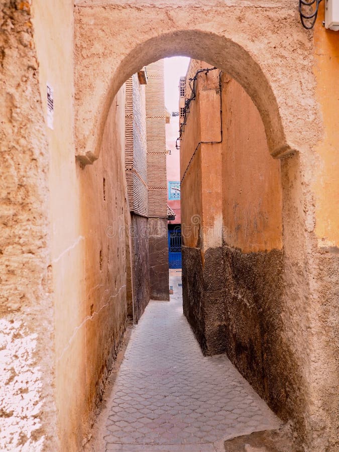 Vertical Shot of a Narrow Path through an Ancient Arch in Marrakesh ...