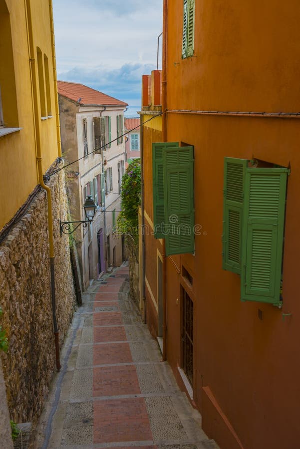 Vertical Shot of a Narrow Pathway Surrounded with Tall Buildings Stock ...