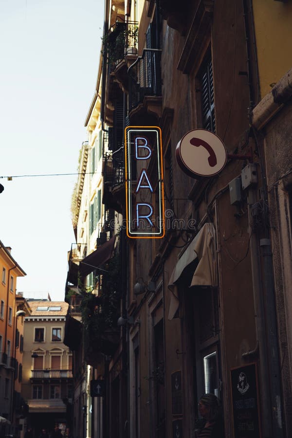Vertical Shot of a Neon Bar Sign on a Building in a Daylight Editorial ...