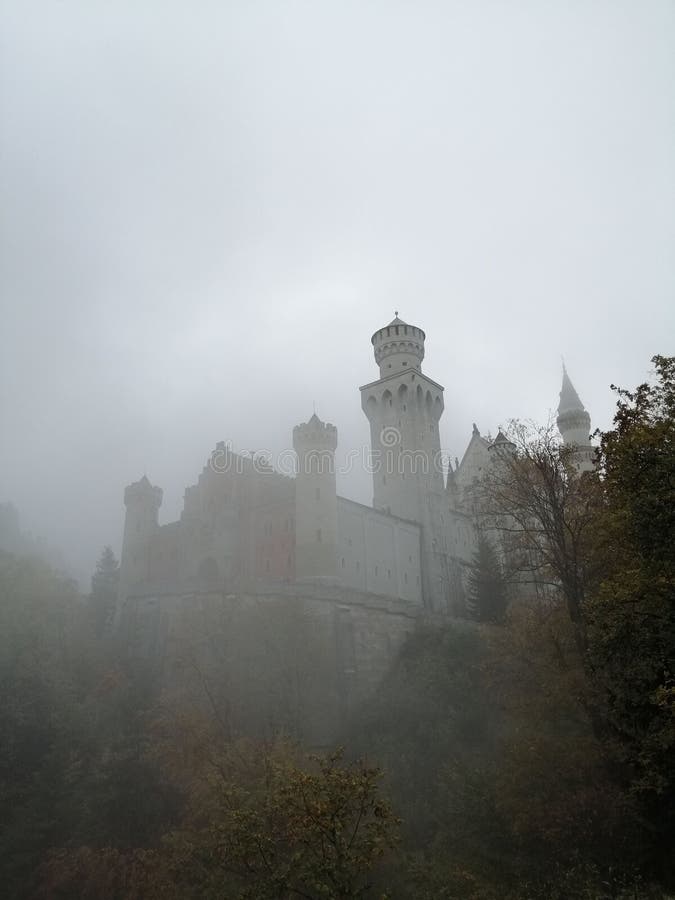 Vertical Shot of the Neuschwanstein Castle in the Mist Stock Image ...