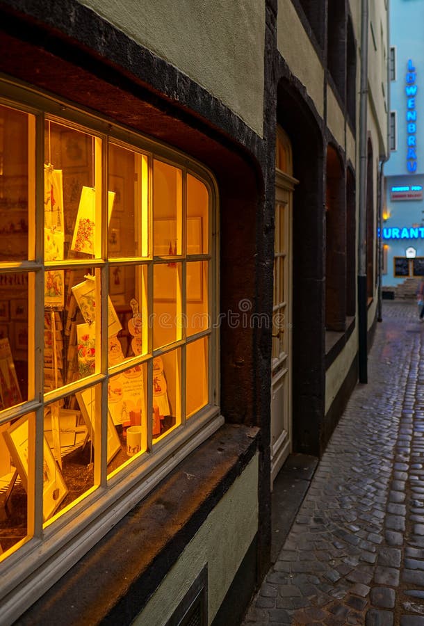 Vertical Shot of a Nicely-illuminated Window in Old Town Cologne ...