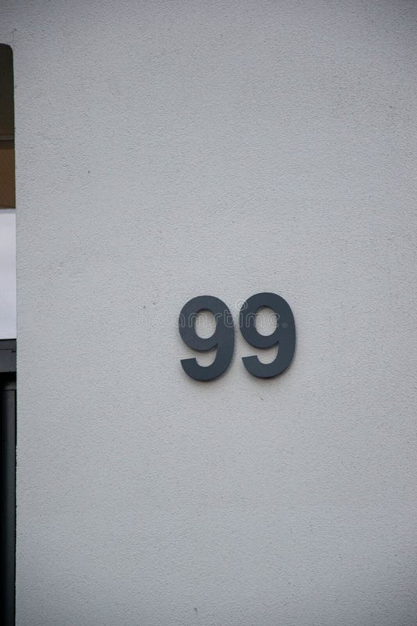 Vertical Shot of the Number 99 on a Door Stock Photo - Image of numbers ...