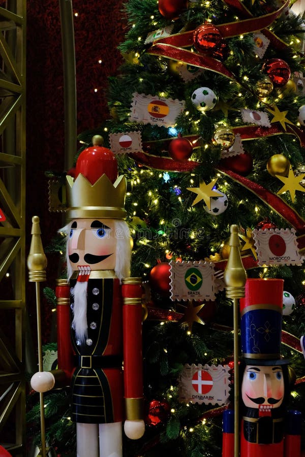 Vertical Shot of the Nutcracker Character in Front of a Christmas Tree ...