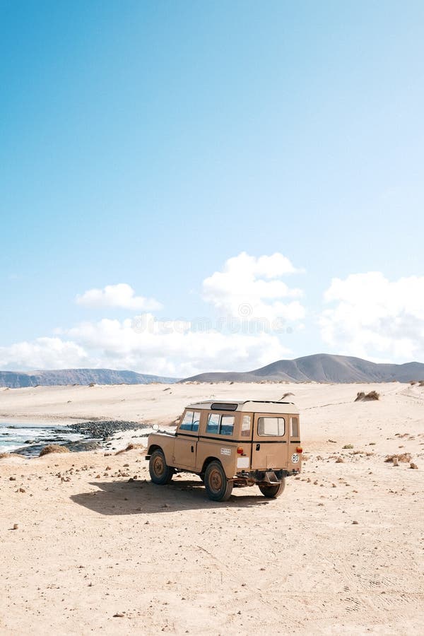 Vertical Shot of an Off-road Car Standing in a Desert Stock Image ...