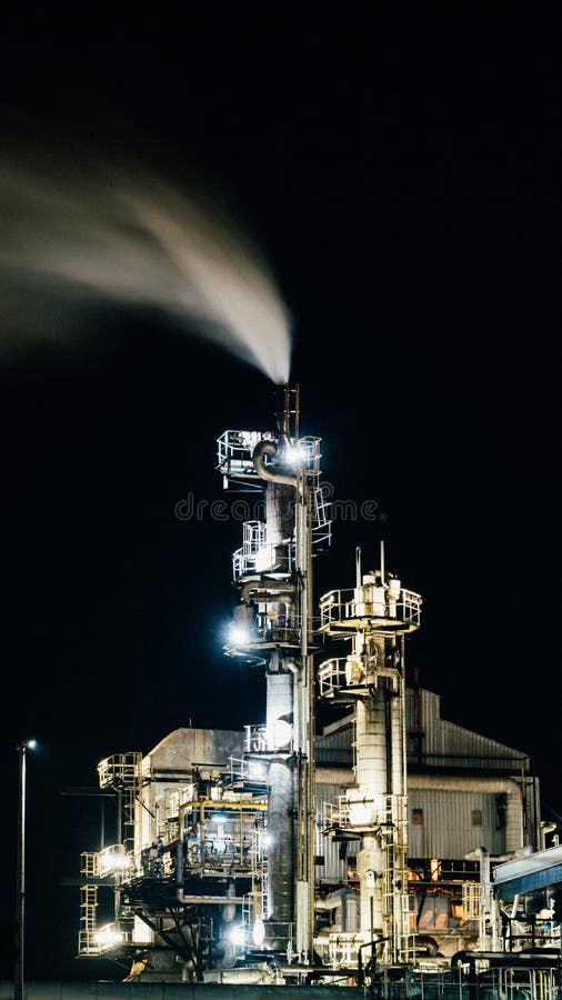 Vertical Shot of an Oil Refinery with Light at Night Stock Image ...