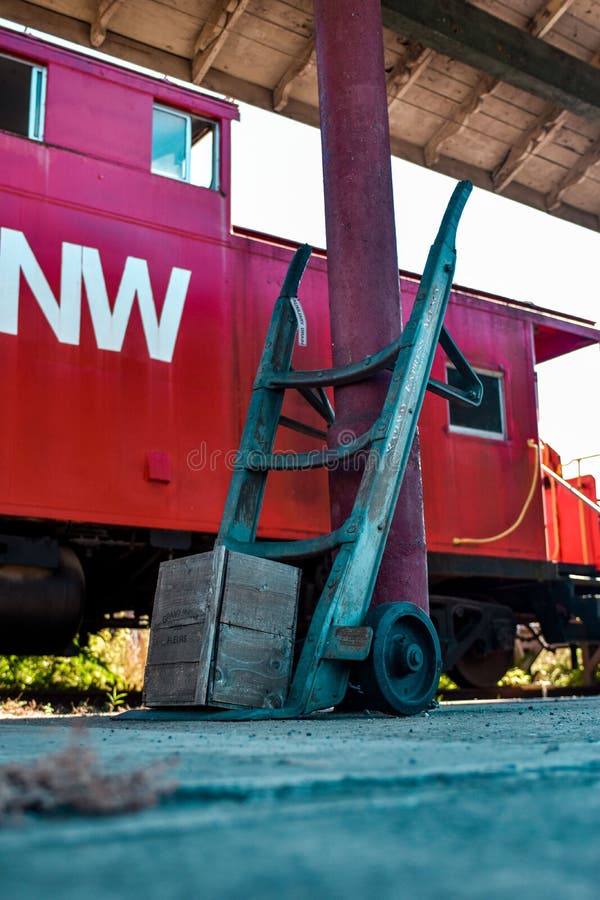 Vertical Shot of an Old Cart at the Train Station. Stock Photo - Image ...