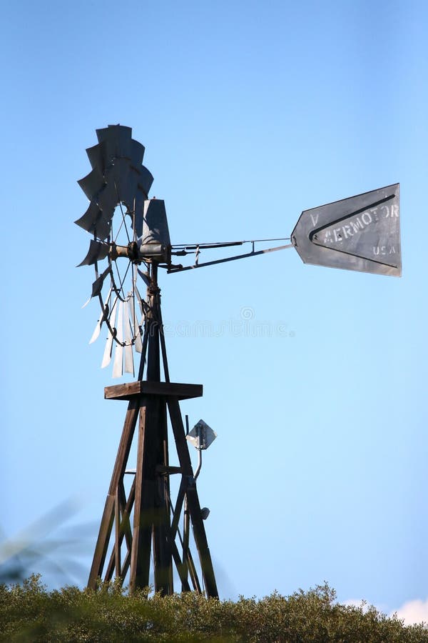 Vertical Shot of Old Farm Windmill on Blue Sky Background Stock Image ...