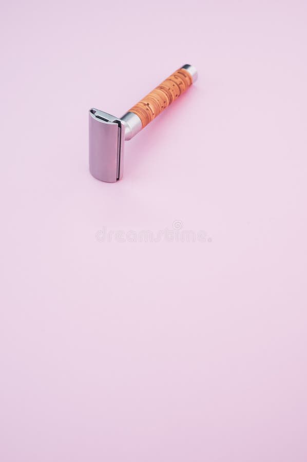 Vertical Shot of an Old Razor on a Pink Surface Stock Image - Image of ...