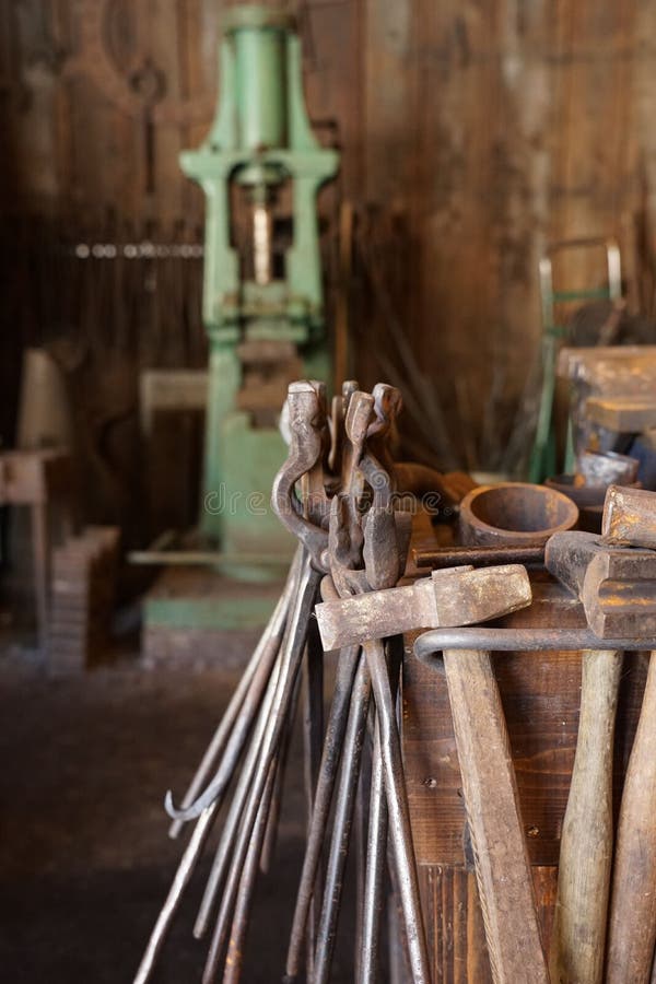 Vertical Shot of Old Rustic Iron Tools Inside a Workshop Stock Image ...