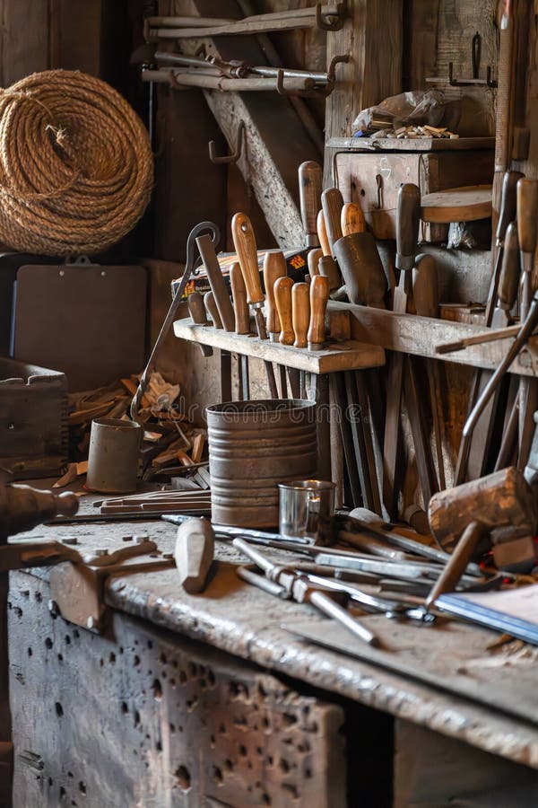 A Vertical Shot of an Old Rustic Wood Workshop with Antique Tools Stock ...