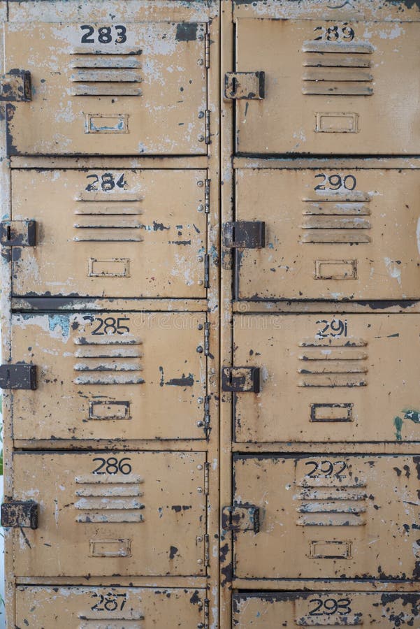 Vertical Shot of Old Rusty Numbered Metal Lockers Stock Photo - Image ...
