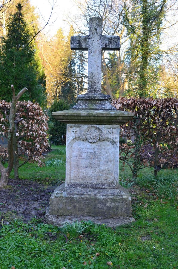Vertical Shot of the Old Tomb with Cross in a Cemetery Editorial Stock ...