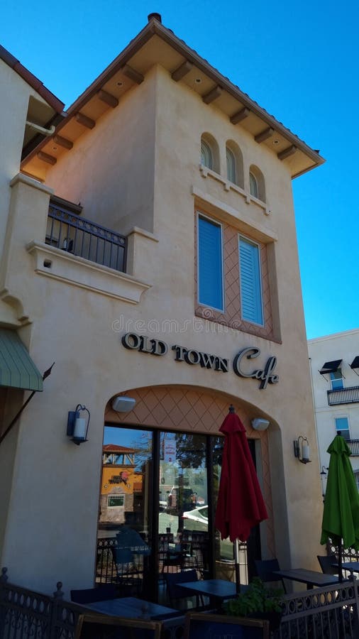 Vertical Shot of the Old Town Cafe Building with the View of a Blue Sky ...