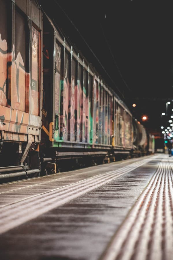 Vertical Shot of an Old Train Covered in Graffiti Art in the ...