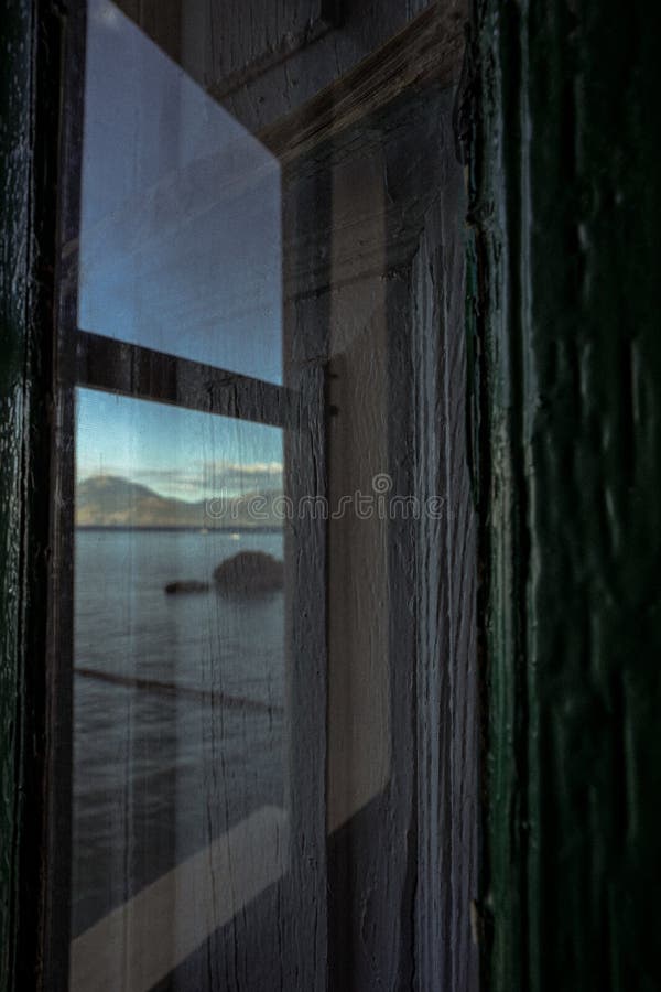 Vertical Shot of an Open Window with the View of the Beautiful Sea ...