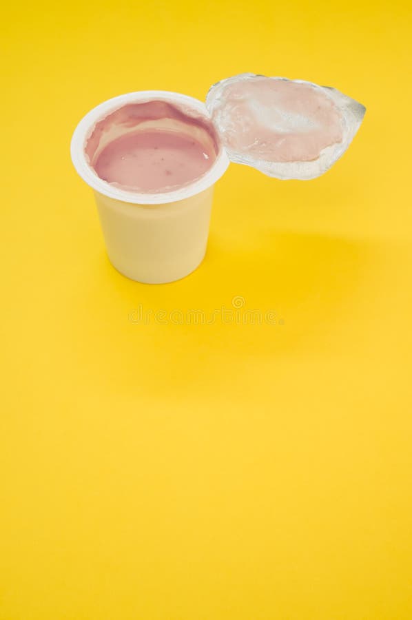 Vertical Shot of an Opened Plastic Container of Fruit Yogurt on a ...