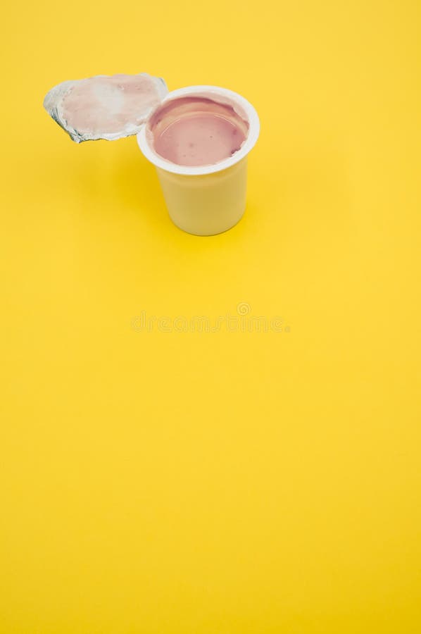 Vertical Shot of an Opened Plastic Container of Fruit Yogurt on a ...