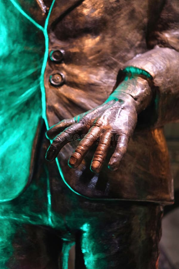 Vertical Shot of the Outstretched Hand of a Statue and the Reflection ...