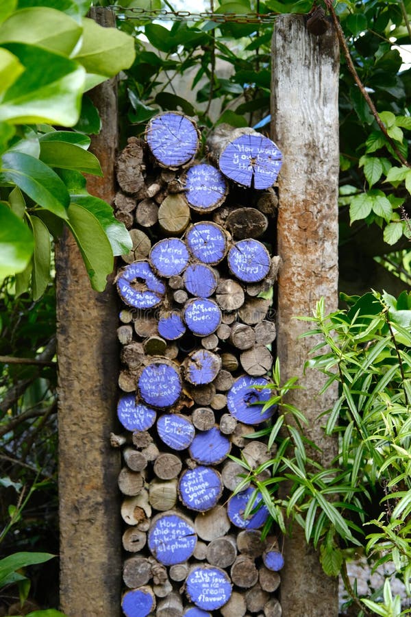 Vertical Shot of Painted Cut Wooden Logs with Messages on Them Stock ...