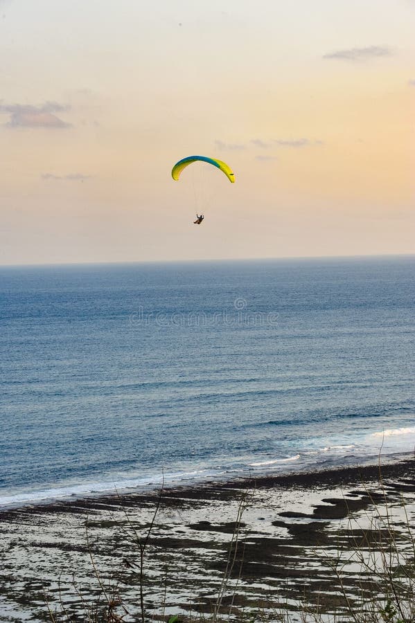 Vertical Shot of a Paraglider Over the Sea Stock Photo - Image of hobby ...