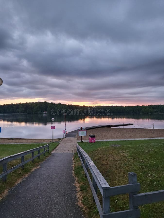 Vertical Shot of a Path To the Lake at the Sunset Stock Photo - Image ...