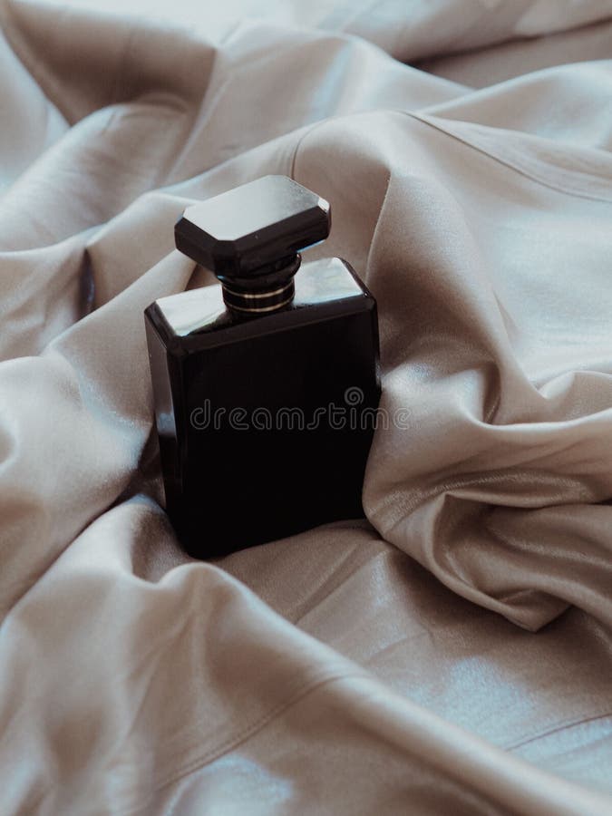 Vertical Shot of a Perfume Bottle on Silk Stock Image - Image of glass ...