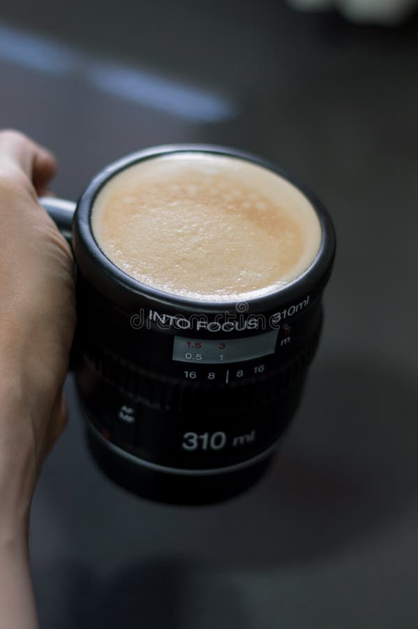 Vertical Shot Of A Person Holding A Camera-shaped Cup Filled With ...