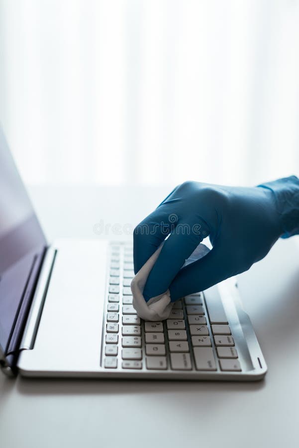Vertical Shot of a Person Sanitizing a Laptop and Keyboard Stock Image ...
