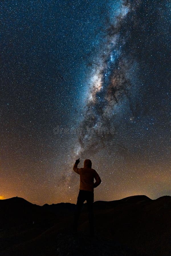 Vertical Shot of a Person in Shadow Looking at Starry Sky Stock Photo ...