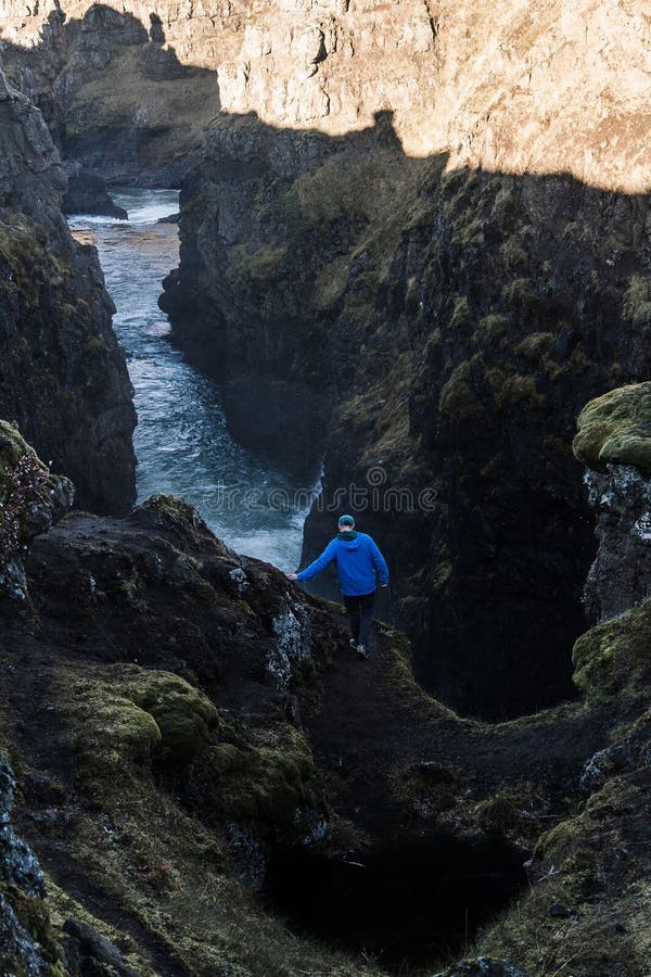 Vertical Shot of a Person Standing on the Edge of a Cliff Editorial ...