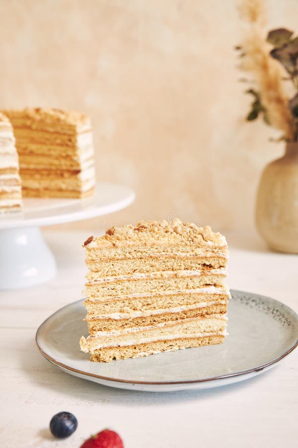 Vertical Shot of a Piece of Cake with a Crumb Topping on a Plate on the ...