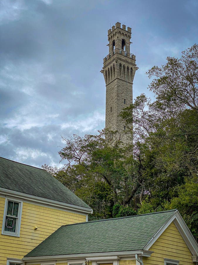 Vertical Shot of the Pilgrim Monument in the Background of a House ...