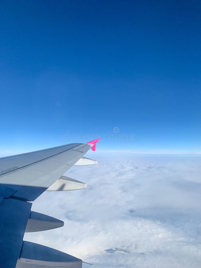 Vertical Shot of a Plane Wing High Above the Sky Stock Image - Image of ...