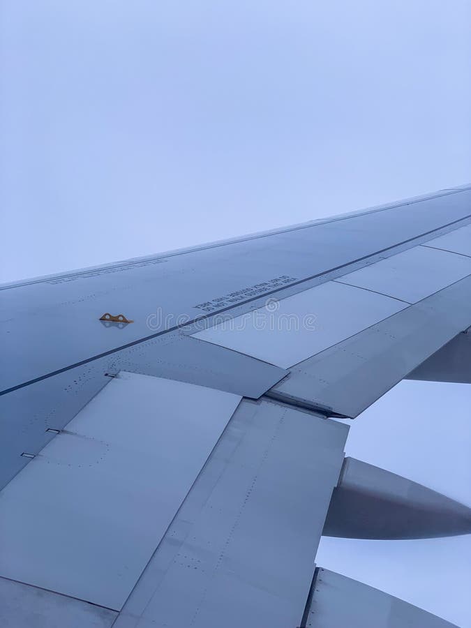 Vertical Shot of a Plane Wing High Above the Sky Stock Image - Image of ...