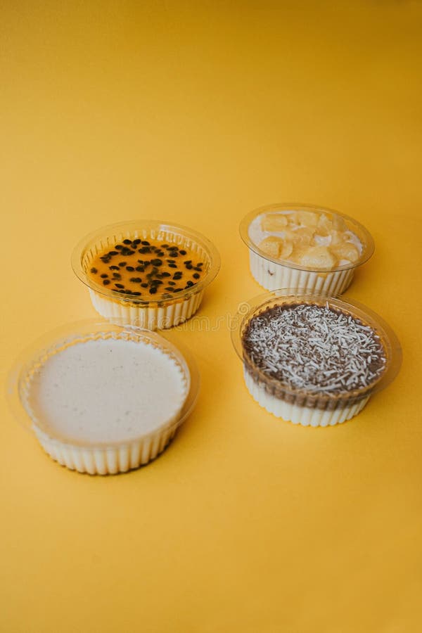Vertical Shot of Plastic Containers with Creamy Pudding with Various ...