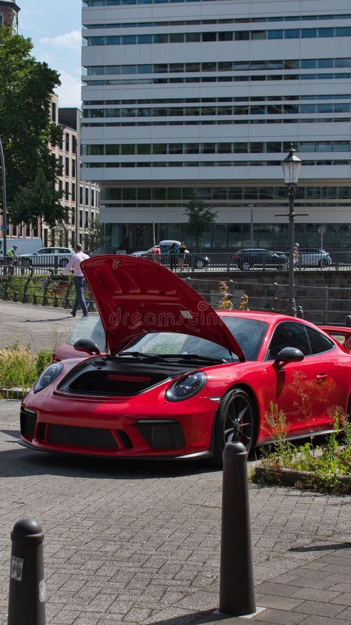 Vertical Shot of Porsche with an Open Trunk Standing in Downtown ...