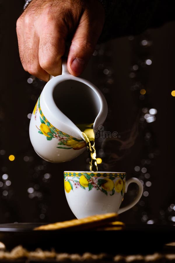 Vertical Shot of Pouring Tea into a Cup. Stock Photo - Image of ...